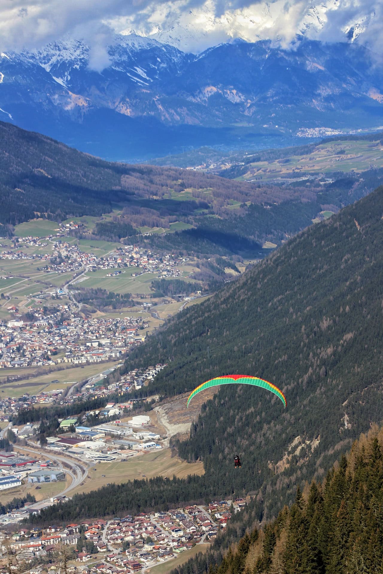 Flying Through the Alps: Paragliding in Austria | We Are Travel Girls