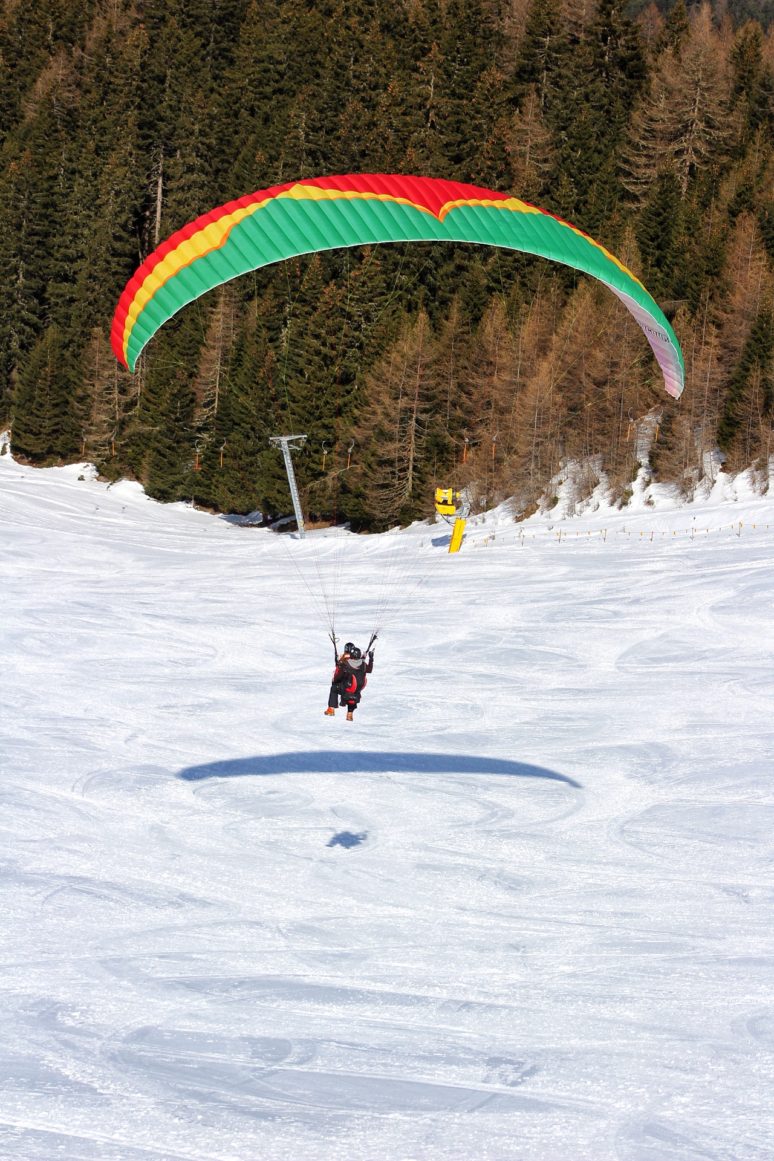 Flying Through the Alps: Paragliding in Austria | We Are Travel Girls